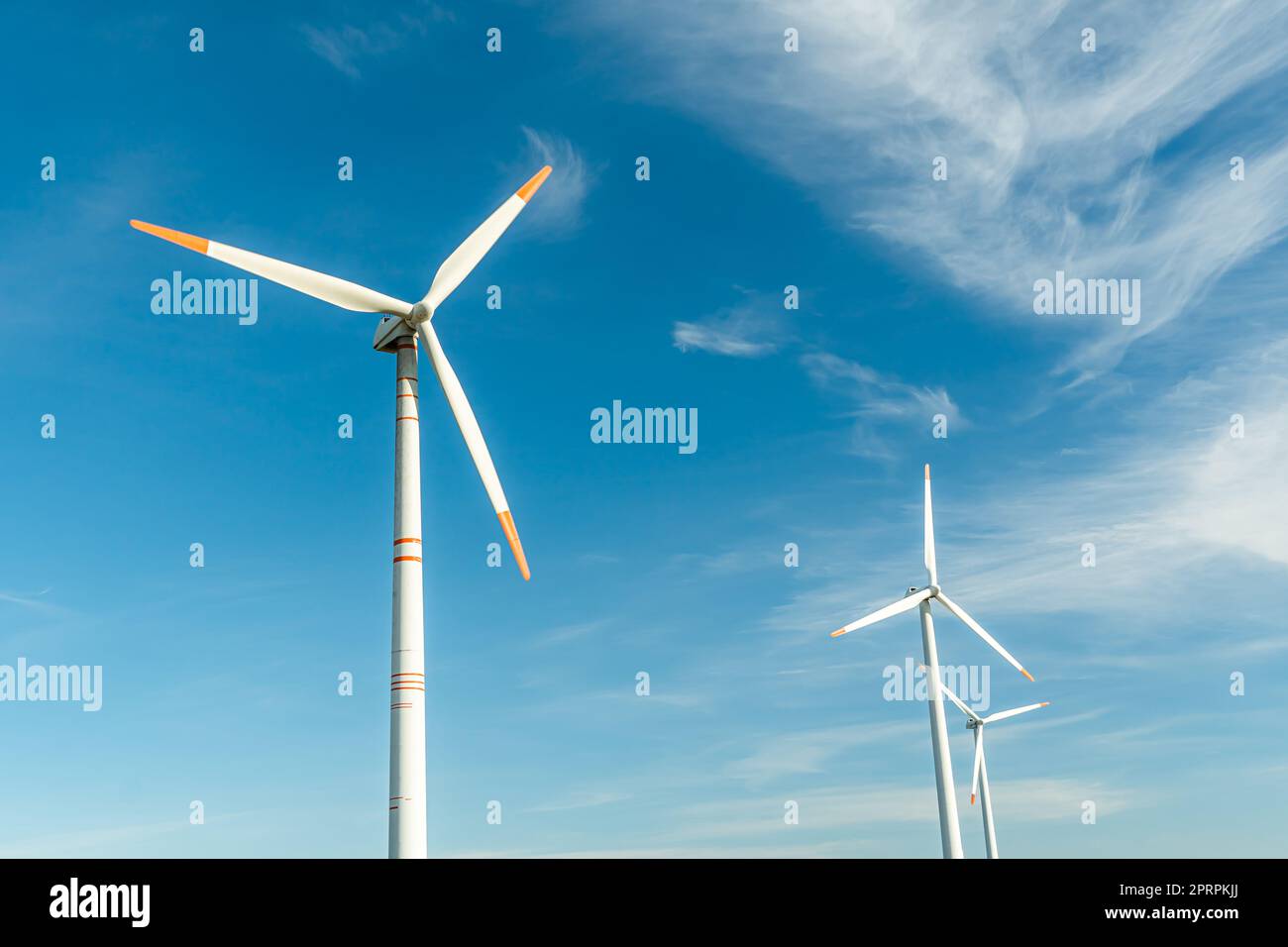 Green energy on wind turbines and wind turbines. Alternative energy sources and renewable energy ...