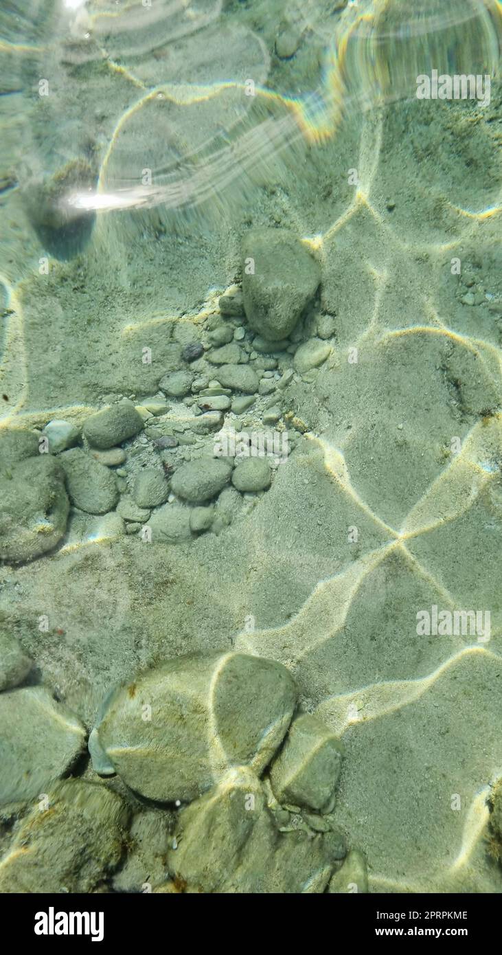 Blurred abstract marine background, stones underwater. Clear sea water ...