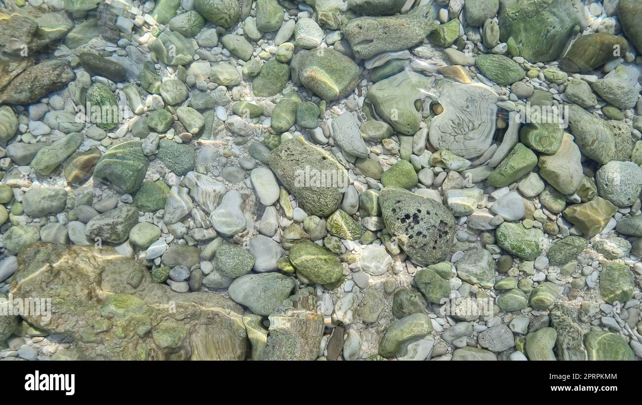 Blurred abstract marine background, stones underwater. Clear sea water ...