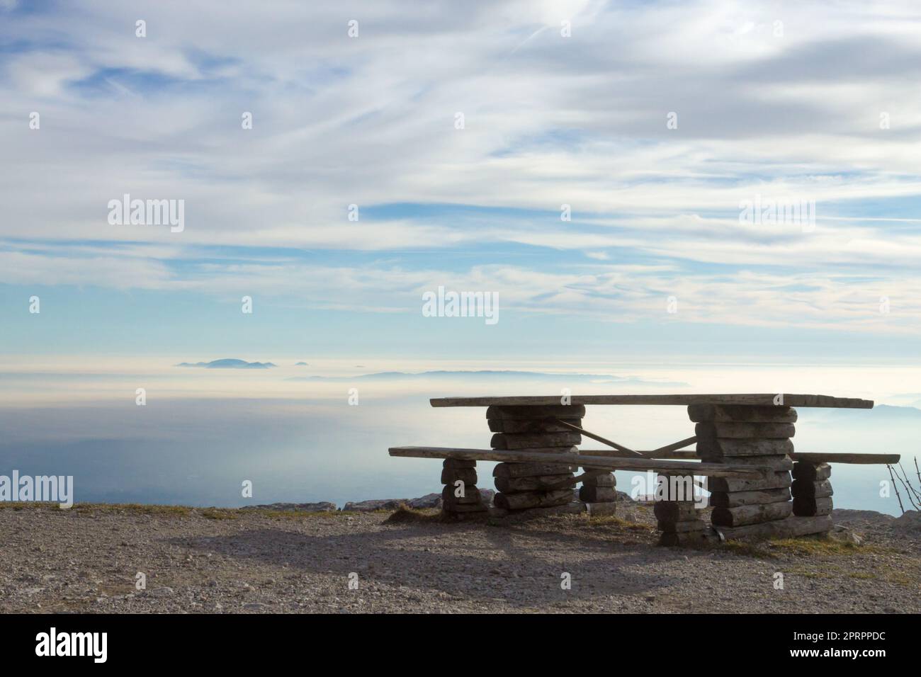 Horizon landscape with clouds and bench in foreground Stock Photo - Alamy