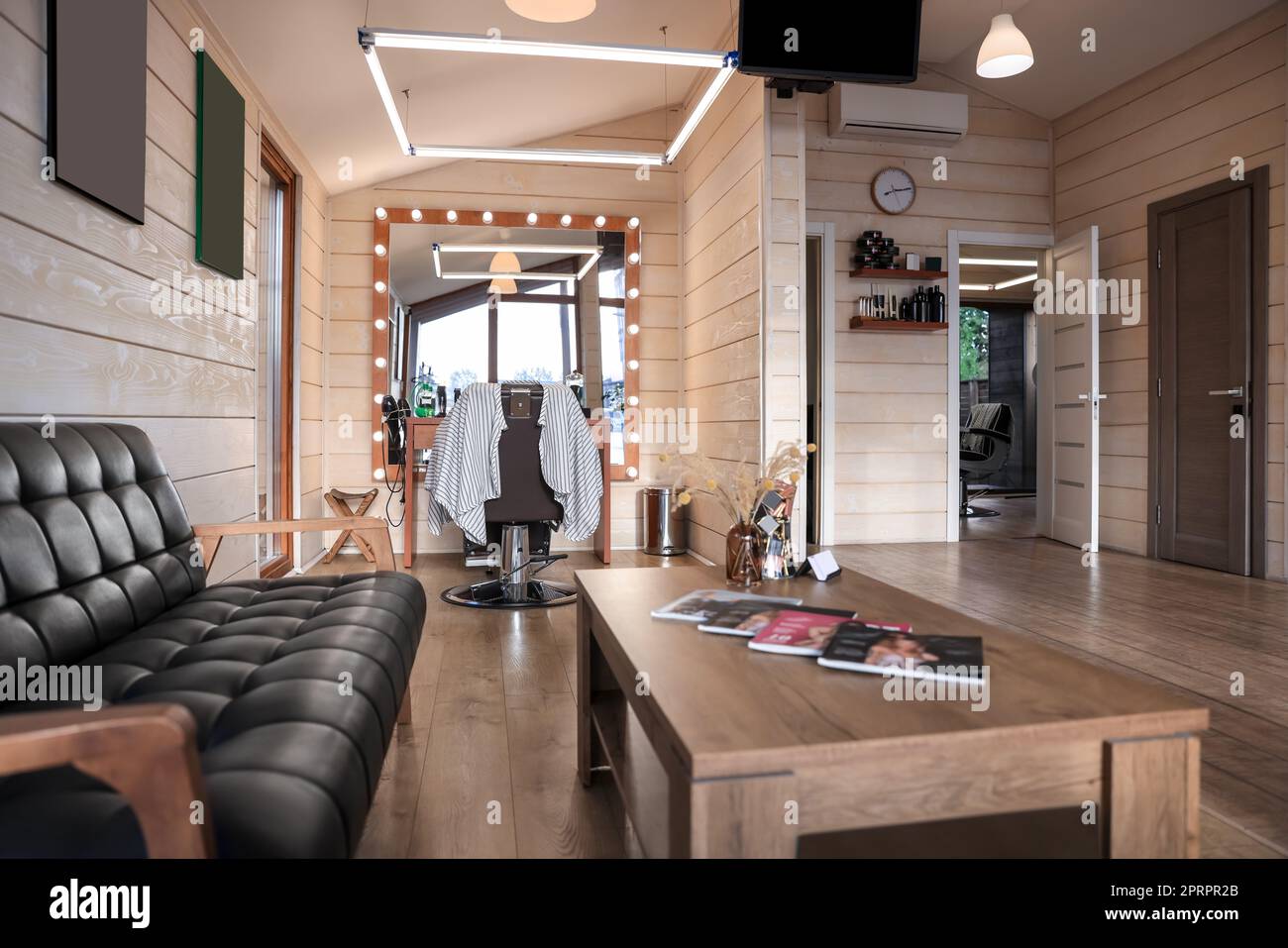 Stylish barbershop interior with hairdresser's workplace and modern ...