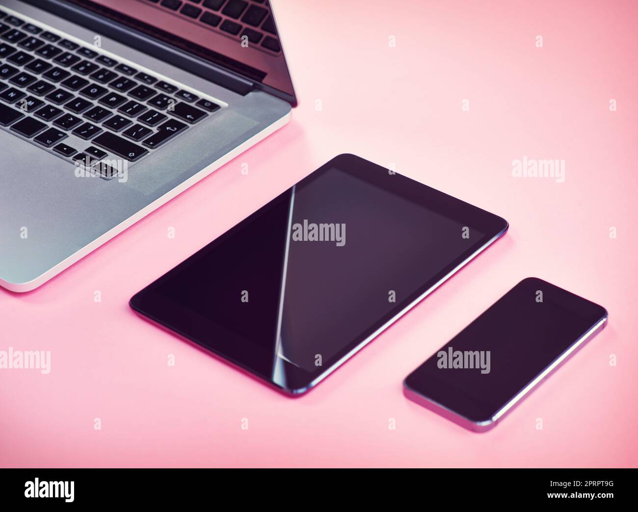 Choose your device. Studio shot of a laptop, tablet and smartphone on a ...