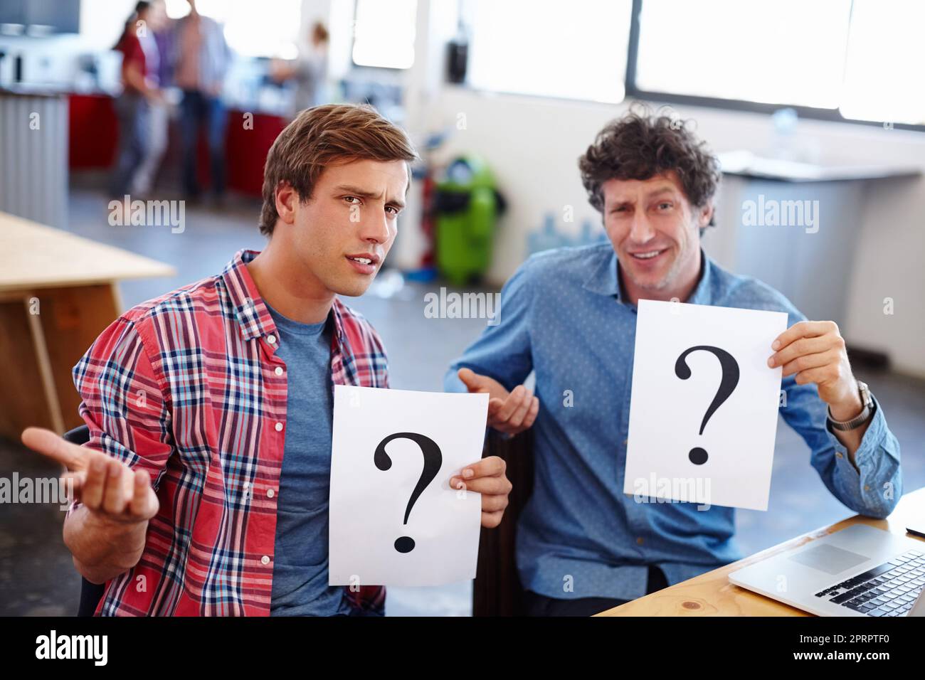 Business is full of questions. Portrait of two coworkers looking ...