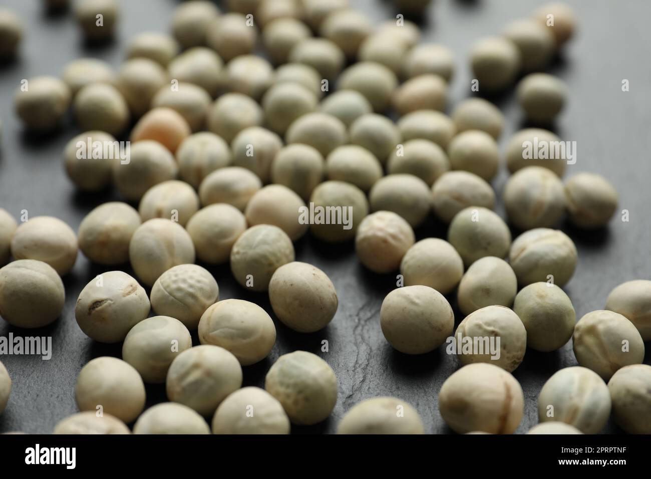 Raw dry peas on grey background, closeup. Vegetable seeds Stock Photo ...
