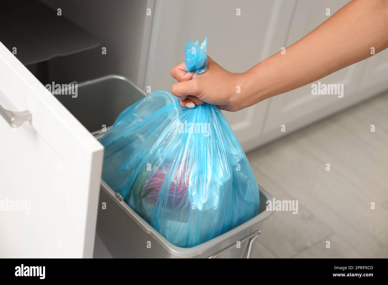 Taking out rubbish female hi-res stock photography and images - Alamy