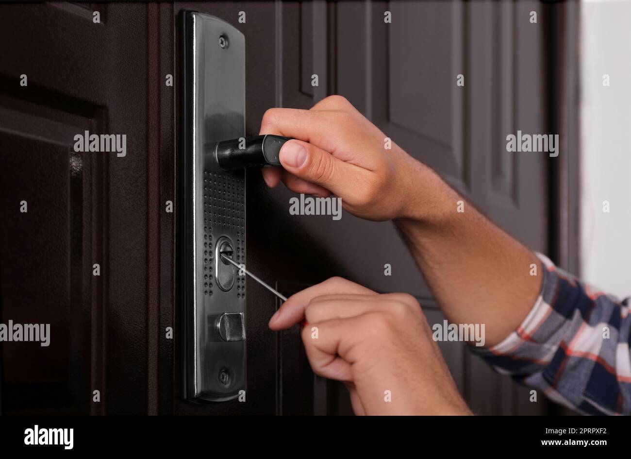 Closeup professional locksmith installing hi-res stock photography and ...