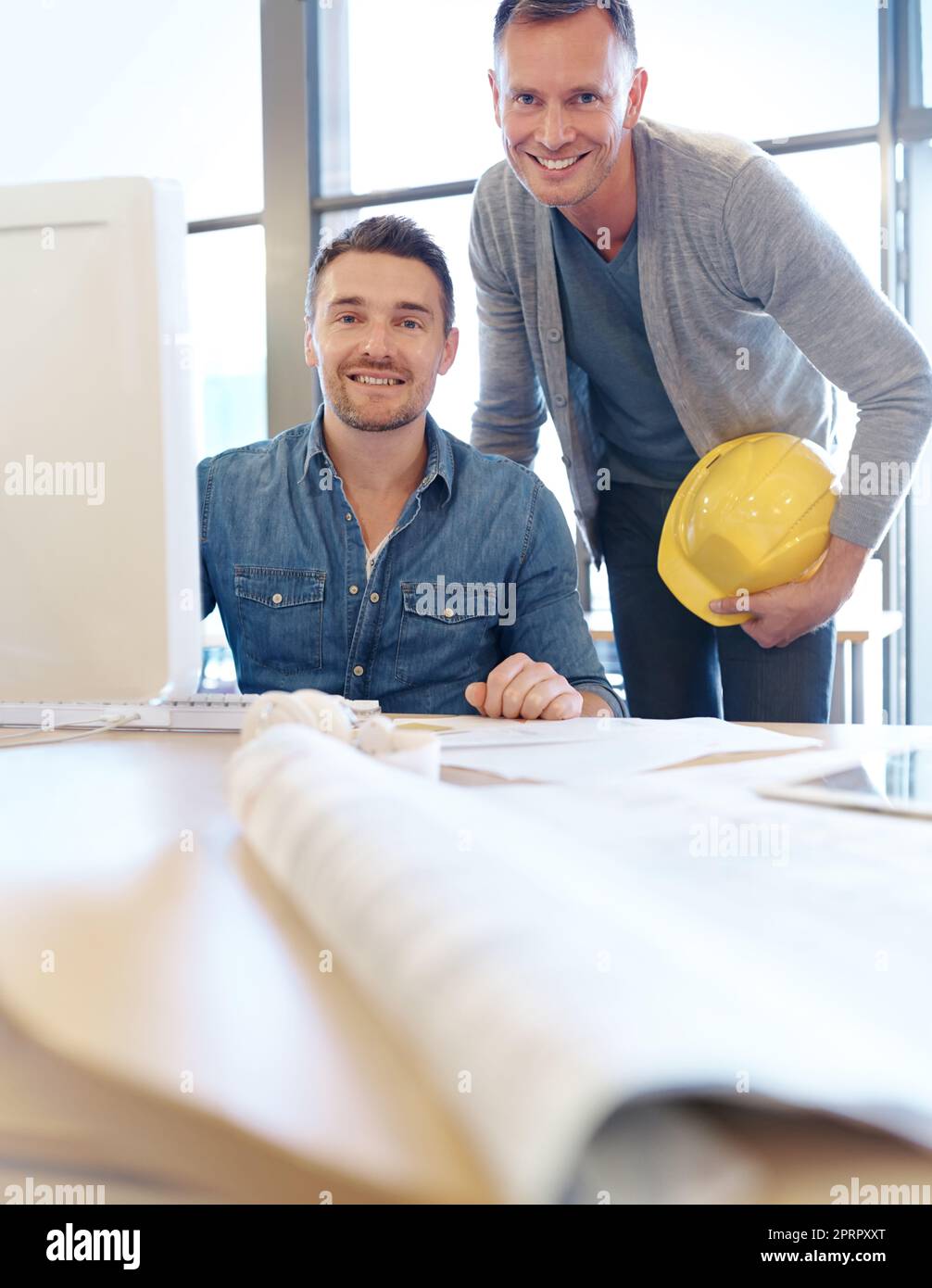 Lets put your plans into production. Portrait of two handsome ...