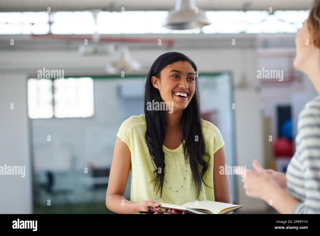 She loves it when their plan comes together. two colleagues having a ...