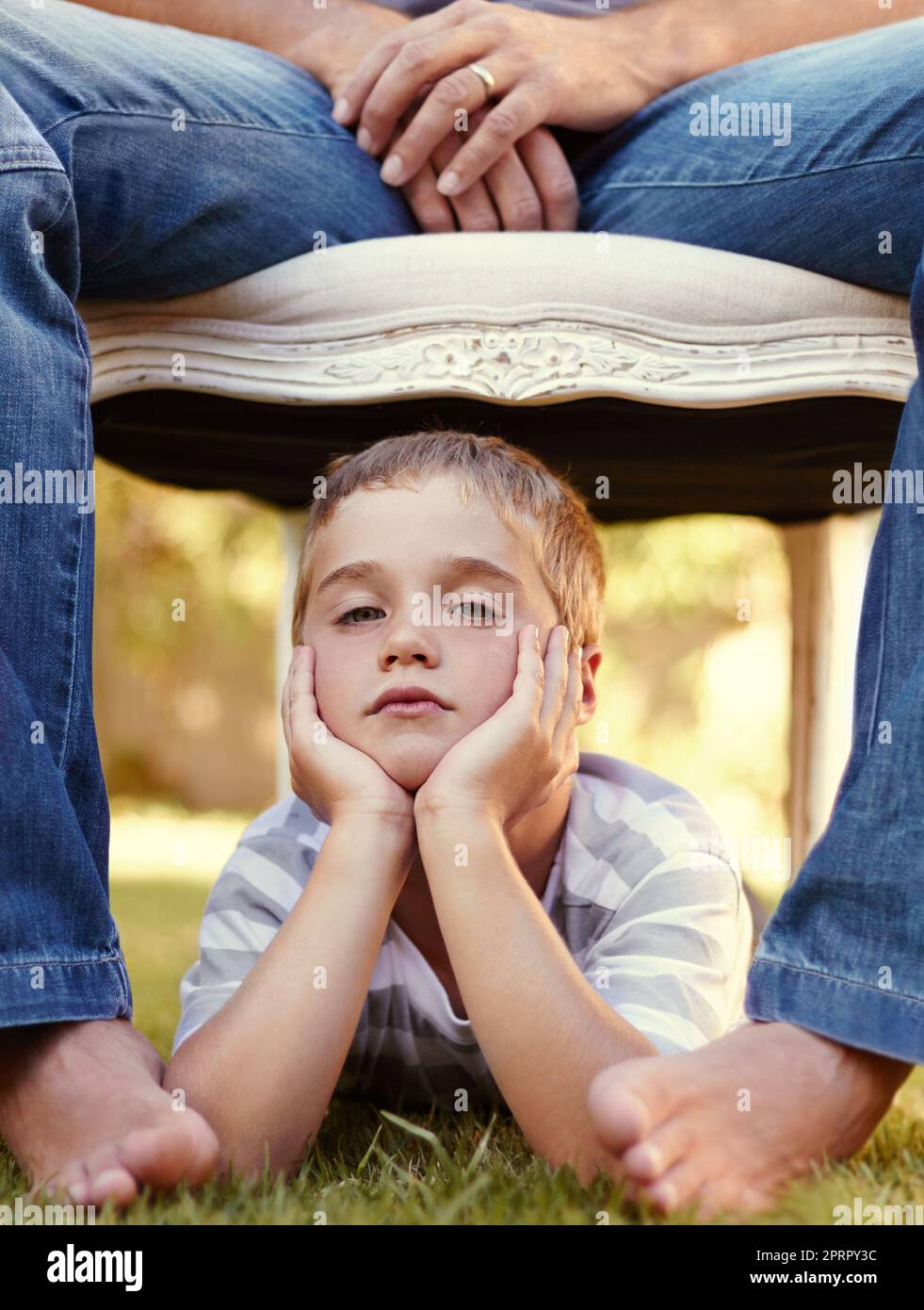 When is the fun getting here. a cute little boy lying on the grass ...