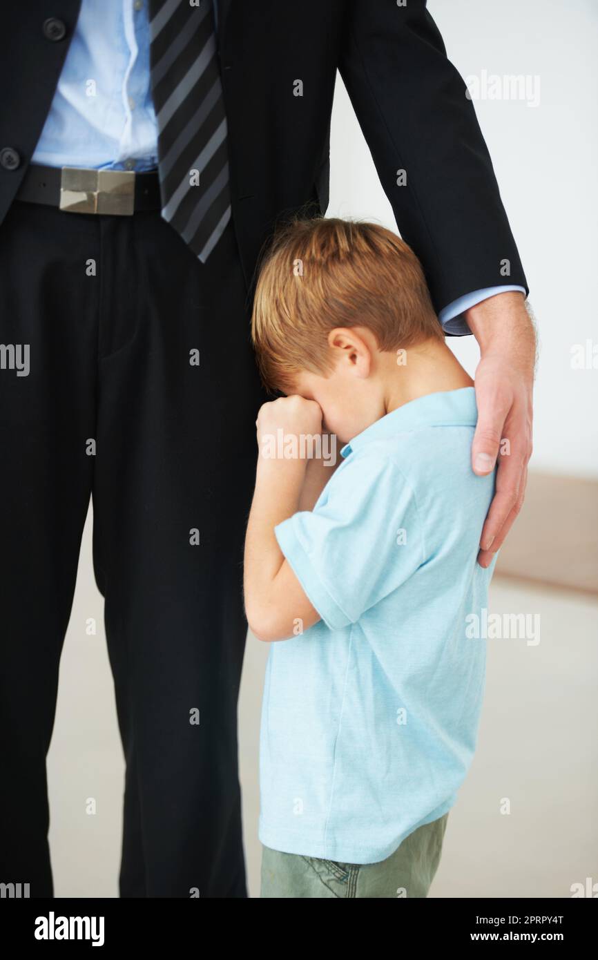 Dont be sad my boy...A father consoling his crying young boy Stock ...