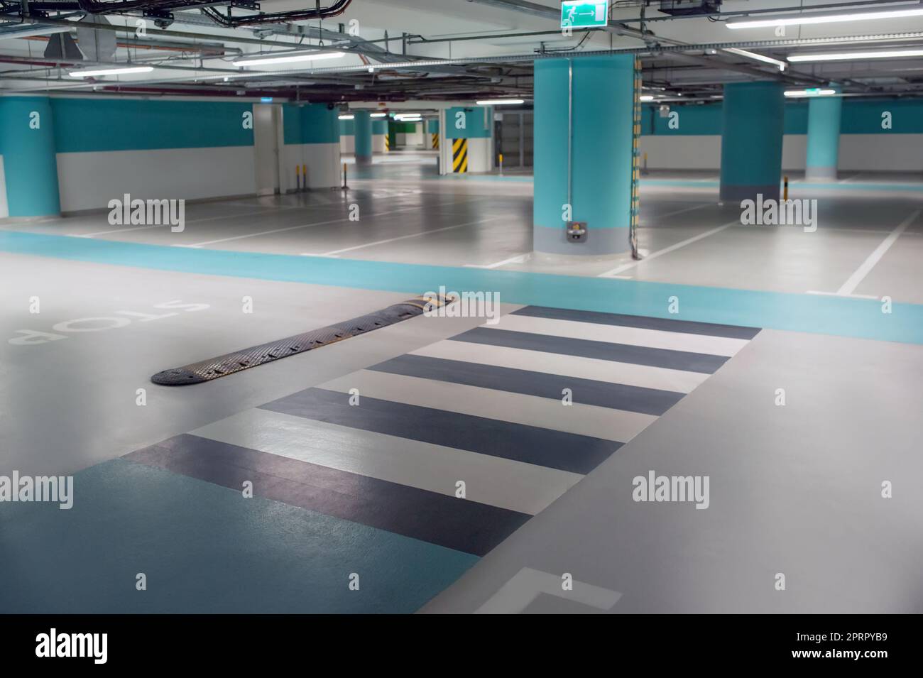 Empty car parking garage with pedestrian crossing and columns Stock ...