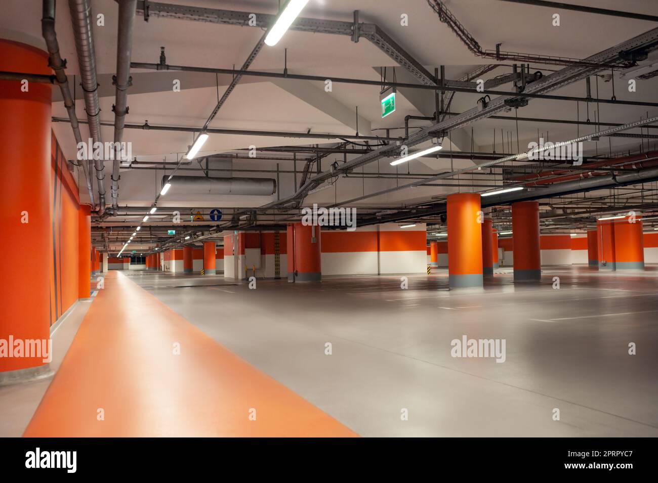 Empty car parking garage with lighting and columns Stock Photo - Alamy