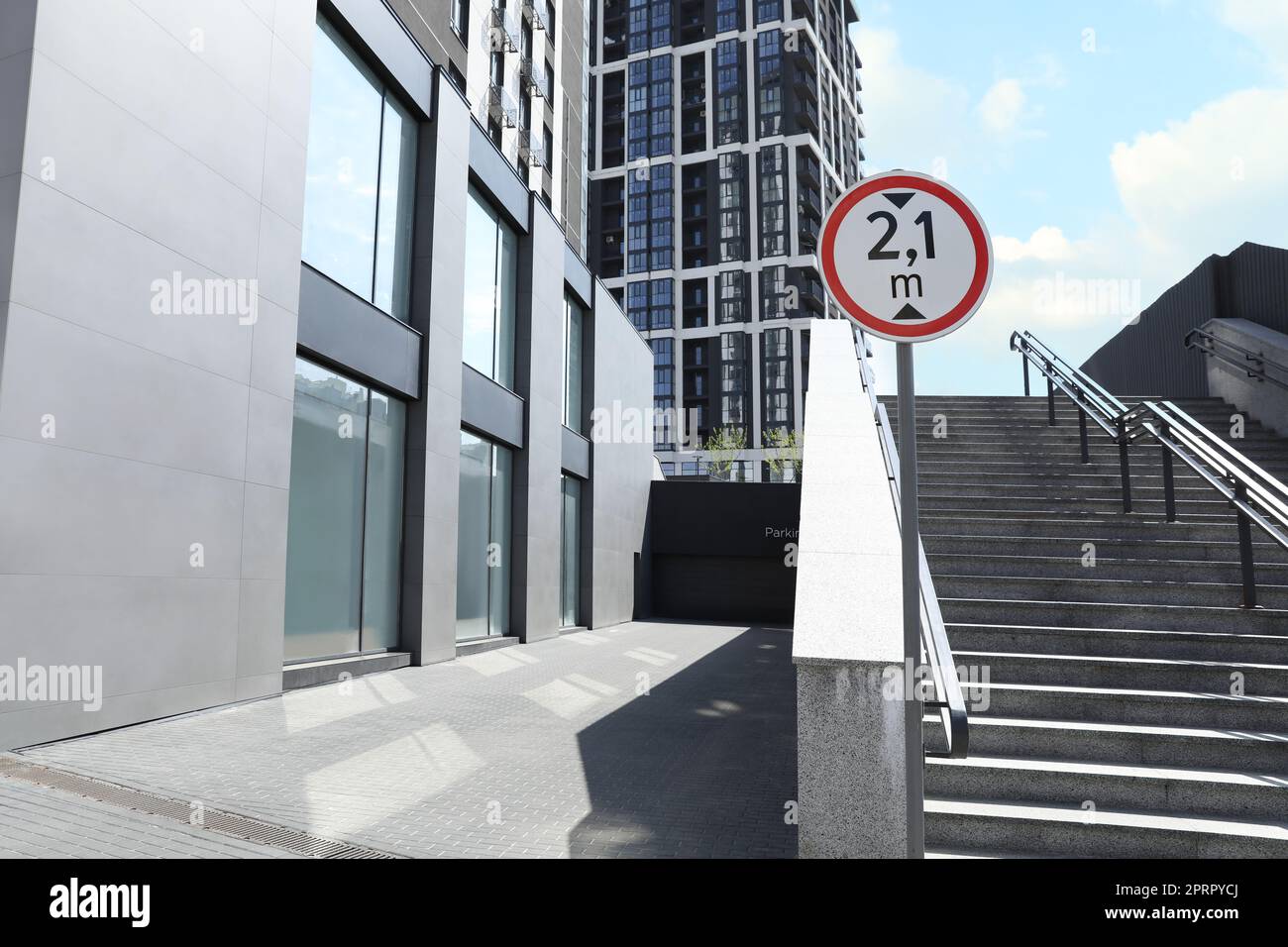 Parking garage with metal gate in modern building Stock Photo - Alamy