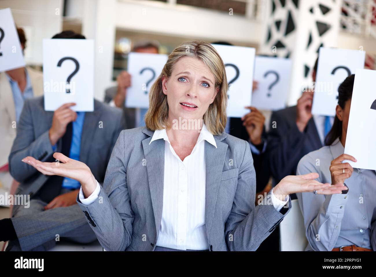Business team holding question marks hi-res stock photography and ...