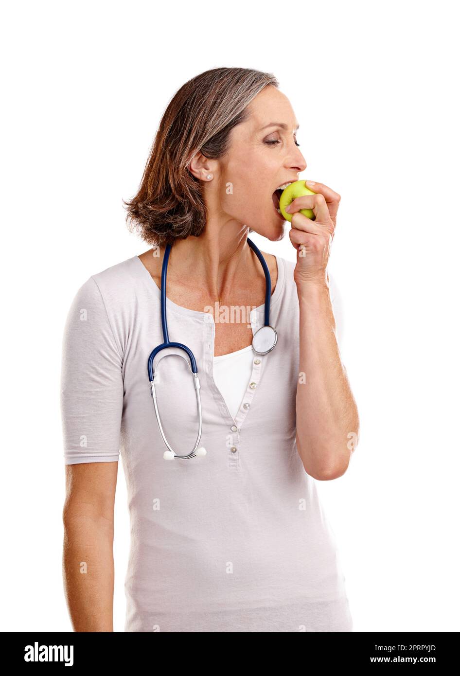 Promoting healthy eating. Cropped studio shot of a mature female doctor ...
