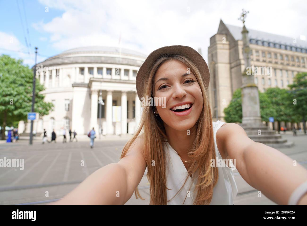 Pretty young woman taking self portrait in Manchester City, England, UK ...