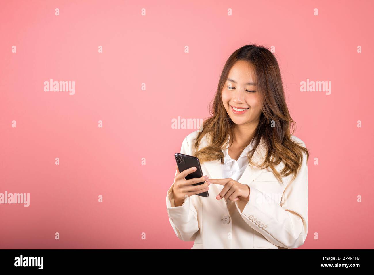 young woman smile making finger pointing on screen smartphone Stock ...