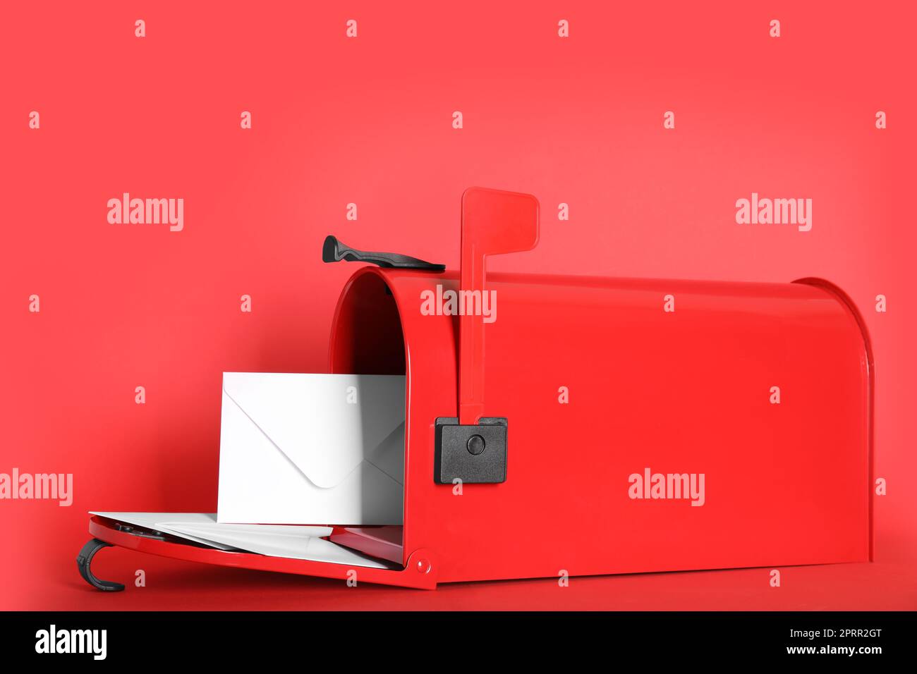 Open letter box with envelopes on red background Stock Photo - Alamy