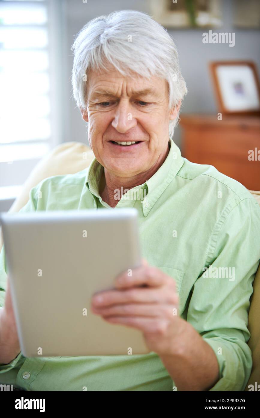 Elderly man sitting on a sofa hi-res stock photography and images - Alamy