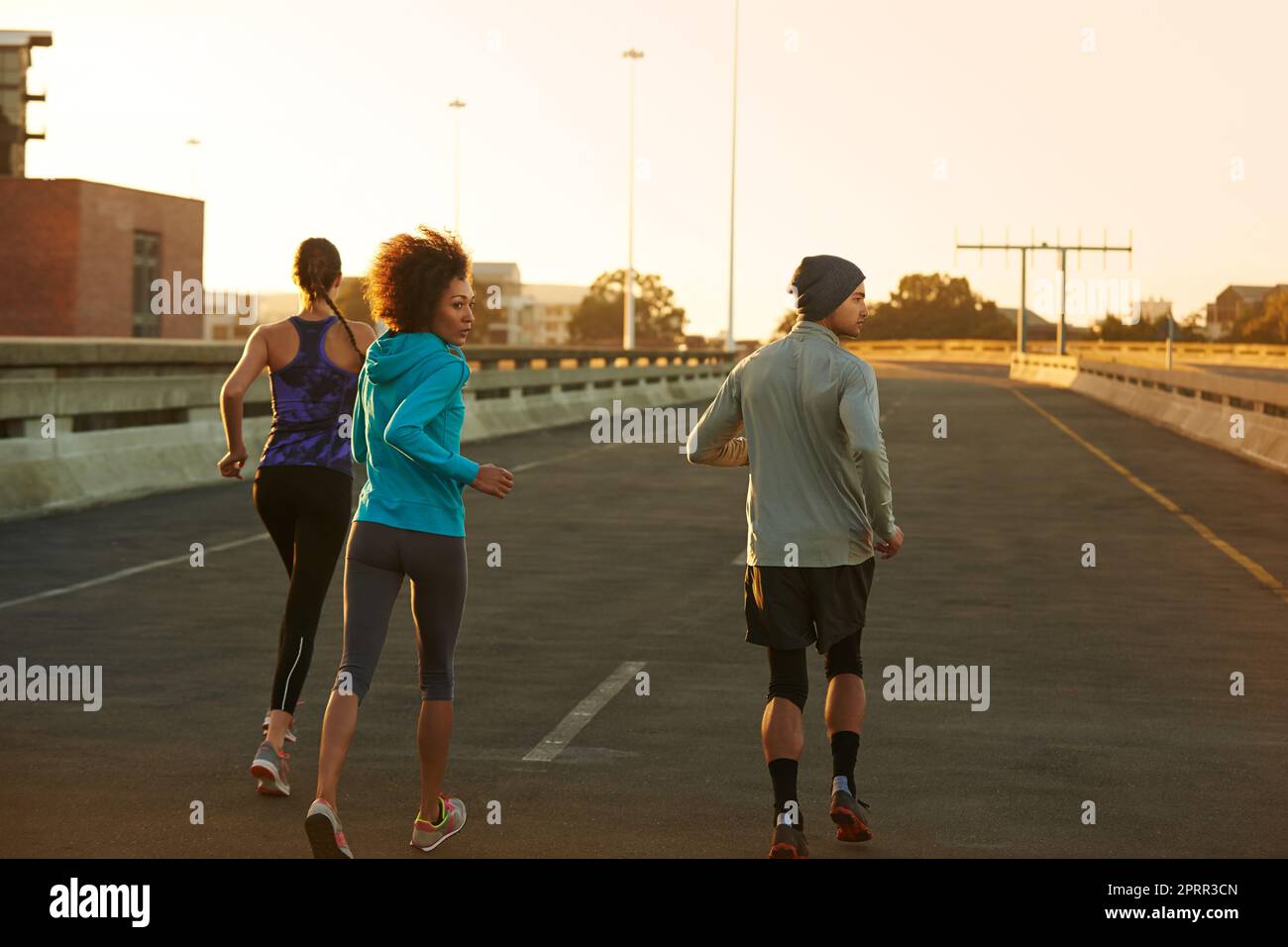 Three joggers hi-res stock photography and images - Alamy
