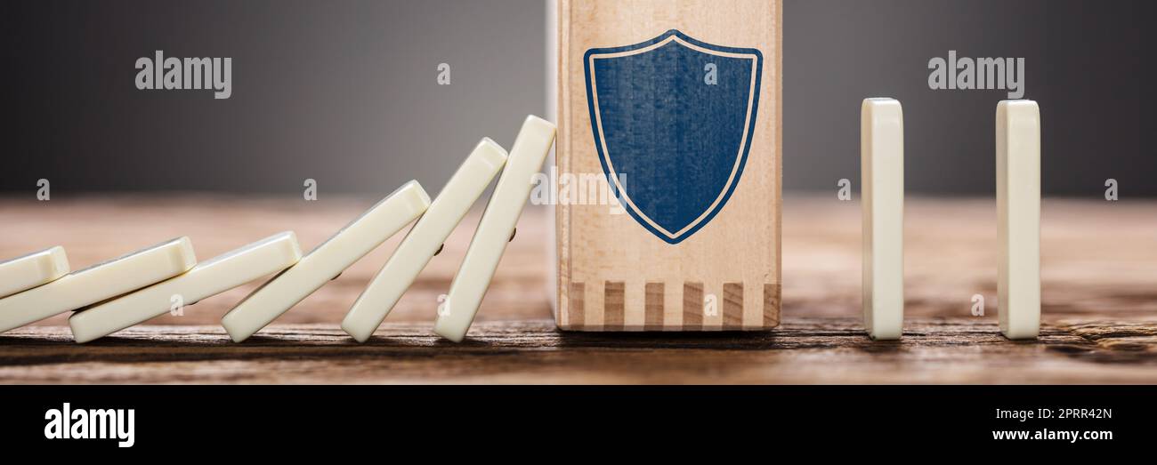 Business Risk Protection Shield. Domino Effect Solution Stock Photo - Alamy