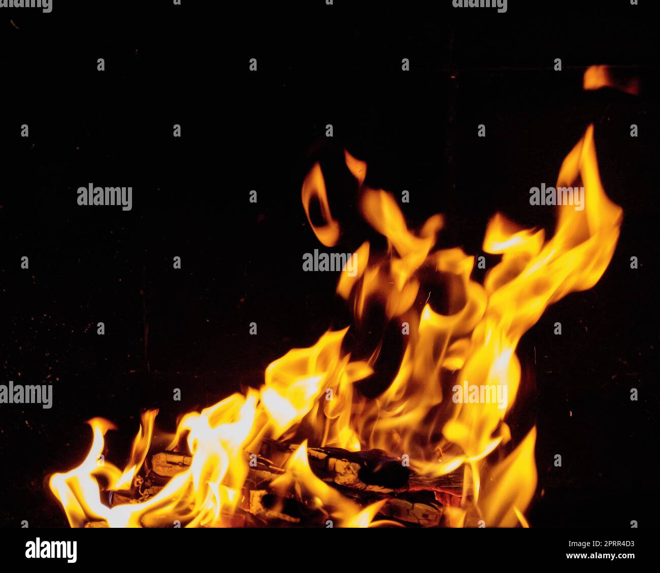 glowing orange flames of fire. symbol of heat and energy Stock Photo ...