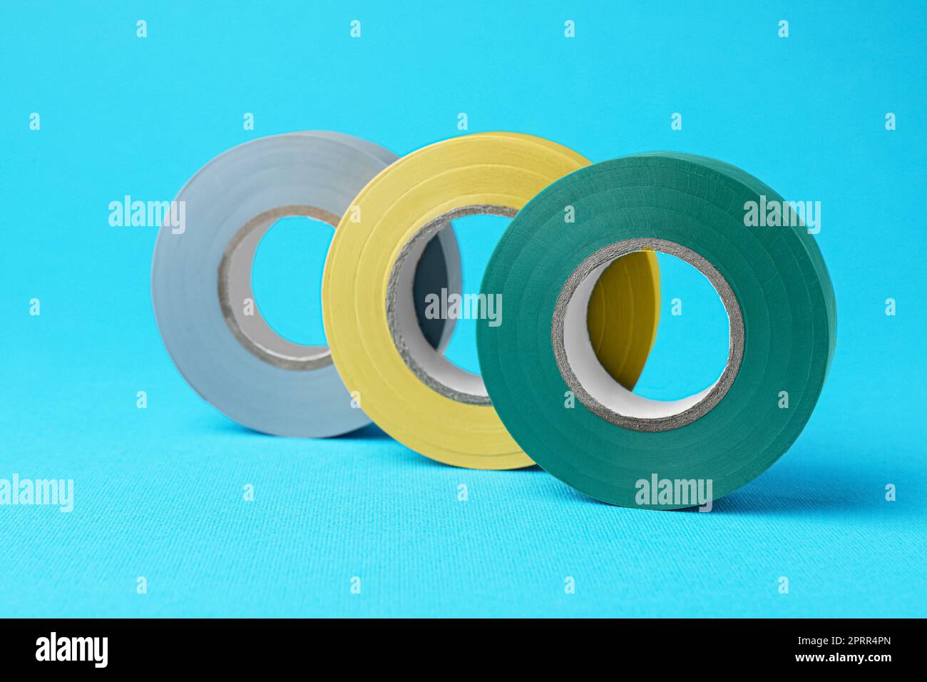 Colorful insulating tapes on light blue background Stock Photo - Alamy