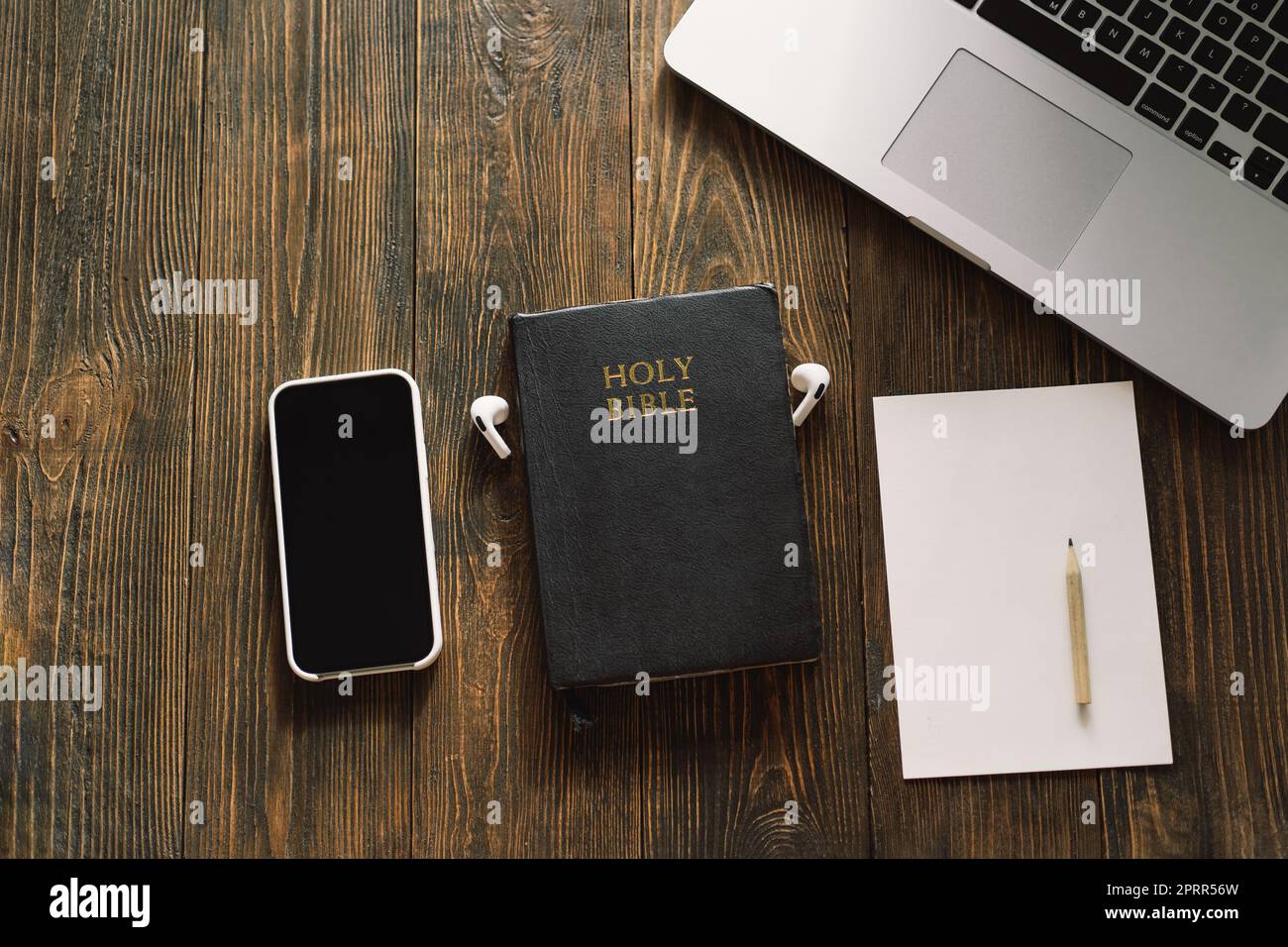Church online Sunday new normal concept. Bible, cell phone and earbuds ...