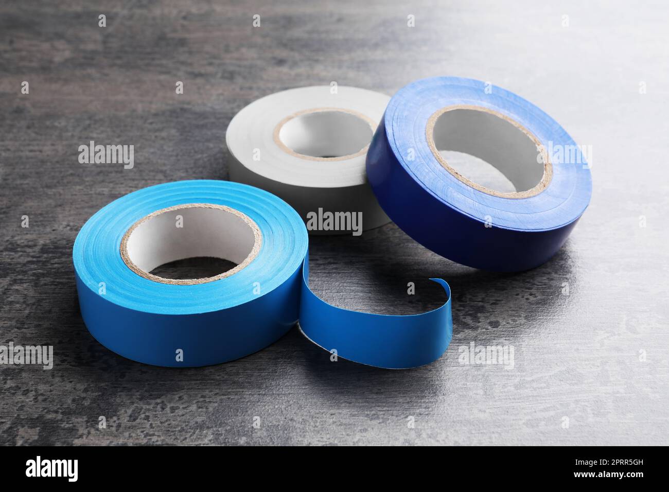 Colorful insulating tapes on dark gray background Stock Photo - Alamy