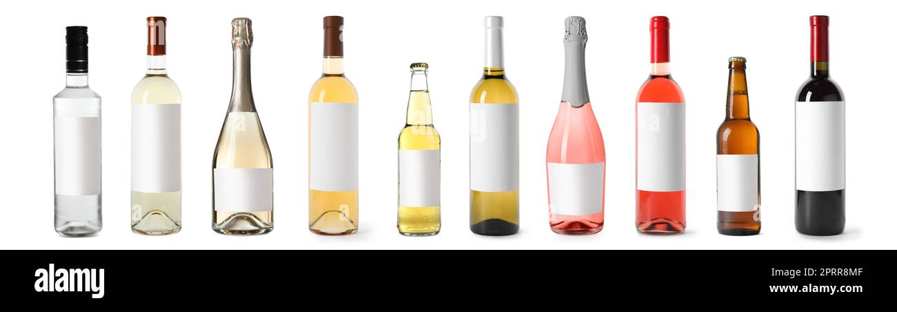 Set with bottles of different alcohol drinks on white background ...