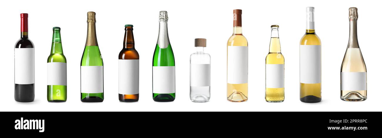 Set with bottles of different alcohol drinks on white background ...