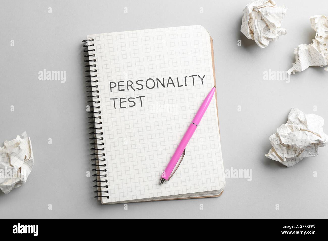 Notebook with text Personality Test, pen and crumpled sheets of paper ...