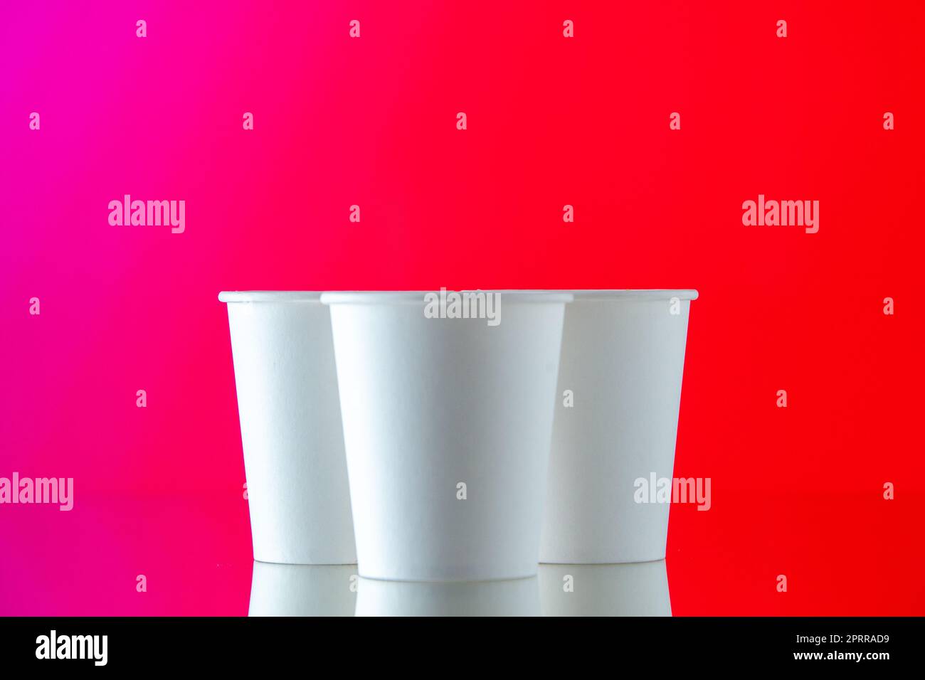 front view paper water cups on red background free space Stock Photo ...