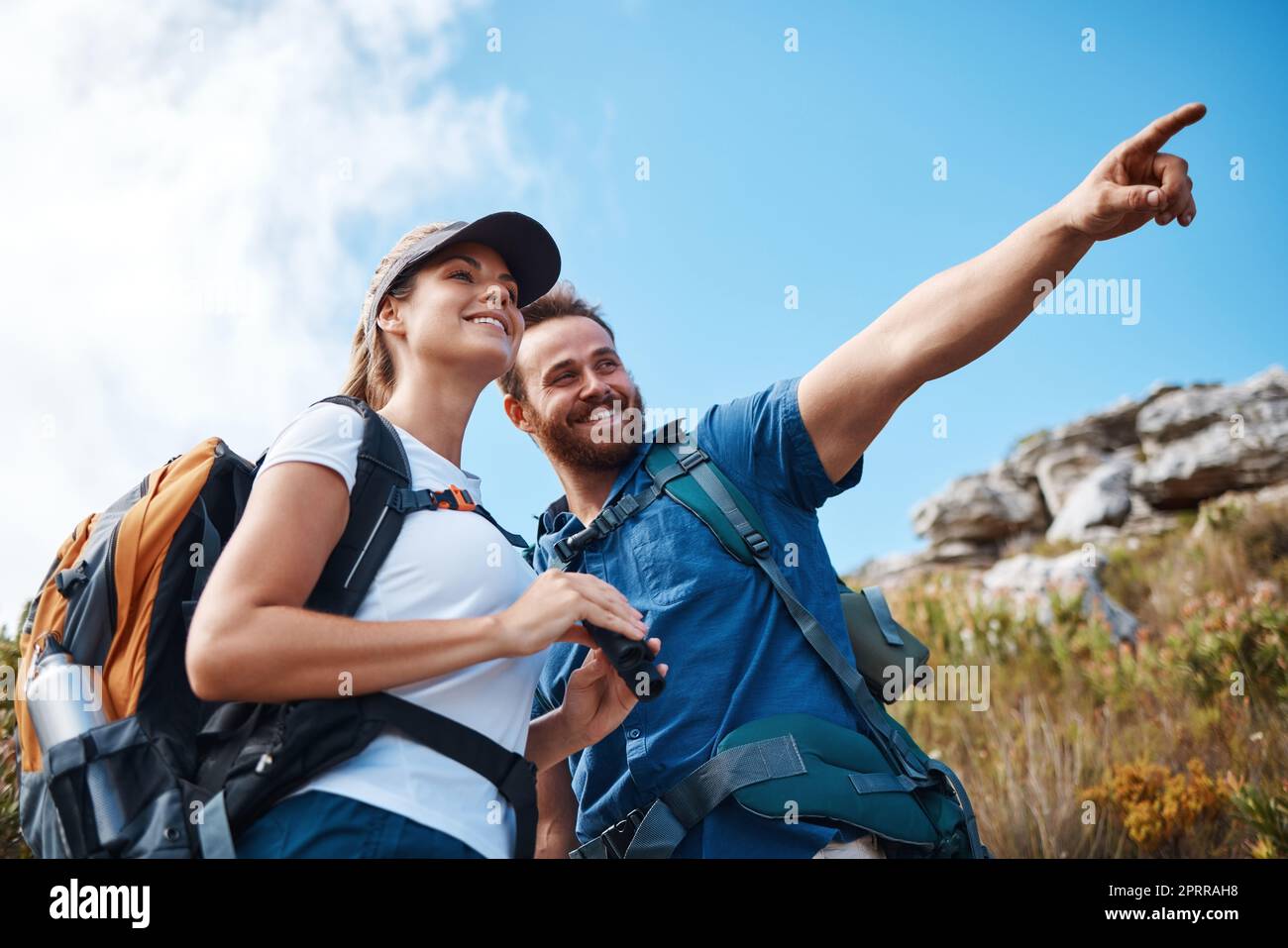 Couple, pointing and bonding on hiking mountains, nature earth ...