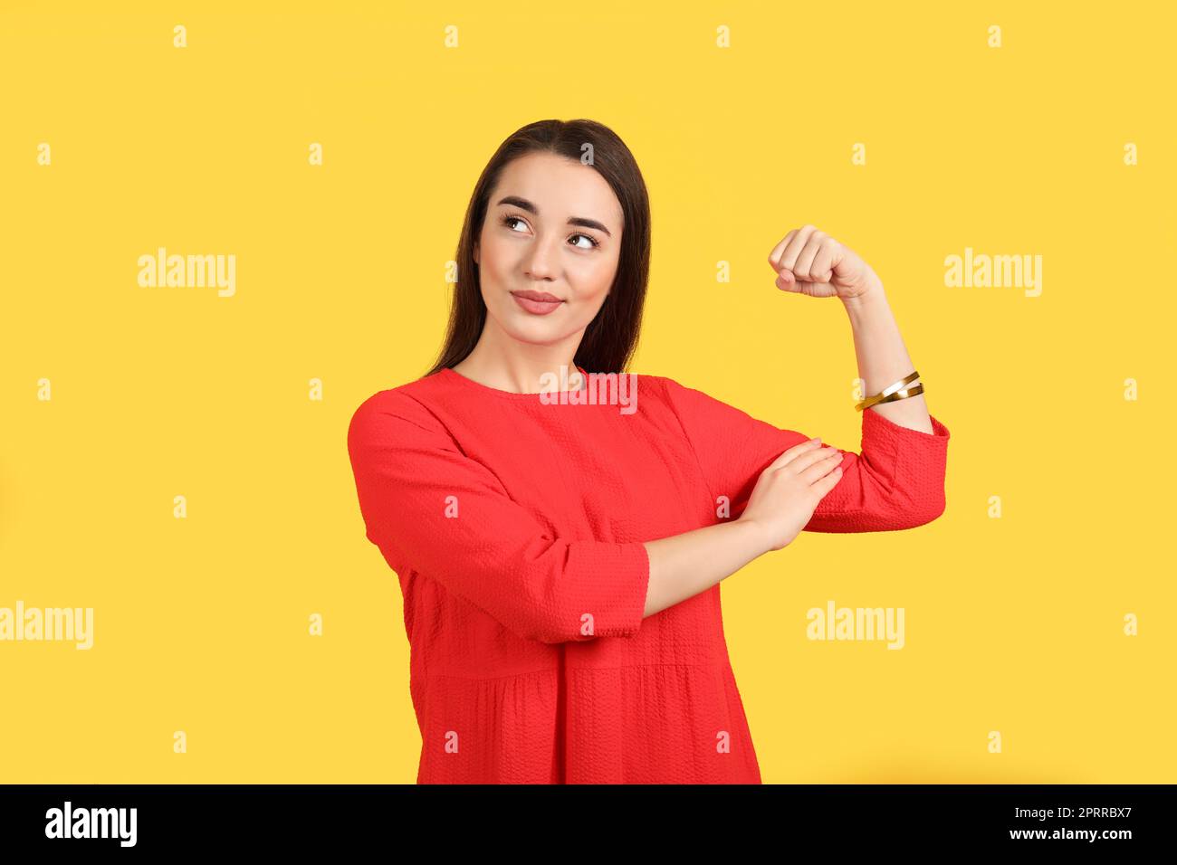 Emotional strong woman as symbol of girl power on yellow background. 8 ...