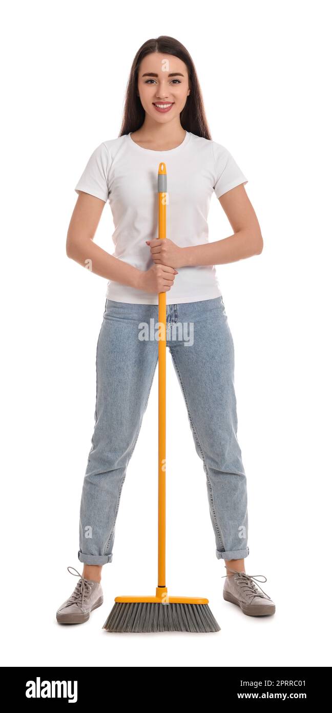Beautiful young woman with broom on white background Stock Photo - Alamy