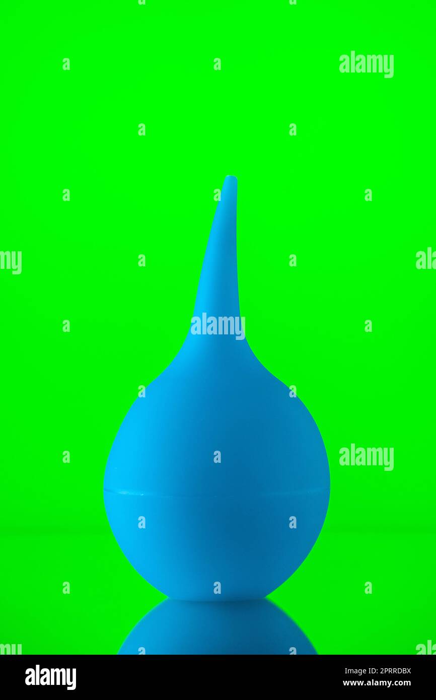 front view squeeze bulb on neon green background Stock Photo - Alamy