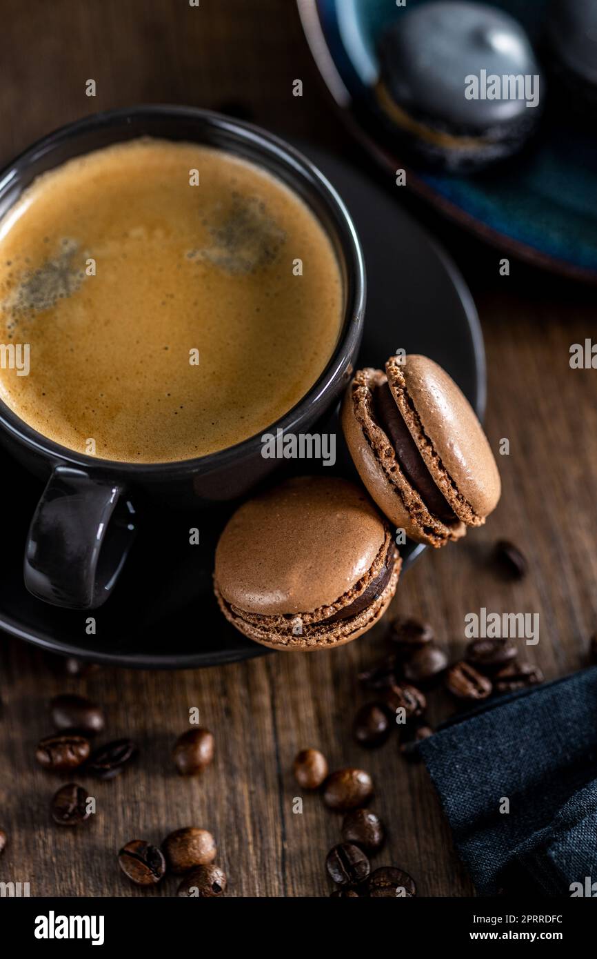 The sweet macaron dessert. Macarons with coffee flavor and coffee cup ...