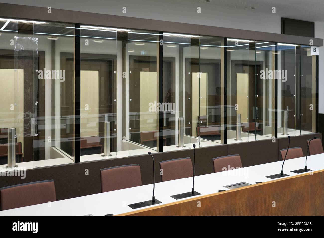 Berlin, Germany. 27th Apr, 2023. The defendants' seats in the glassed ...