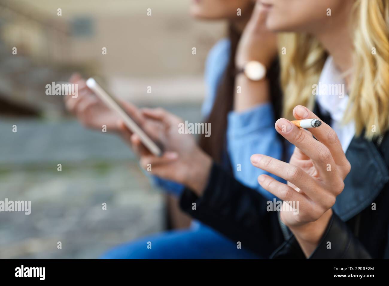 People smoking cigarettes at public place outdoors, closeup. Space for ...