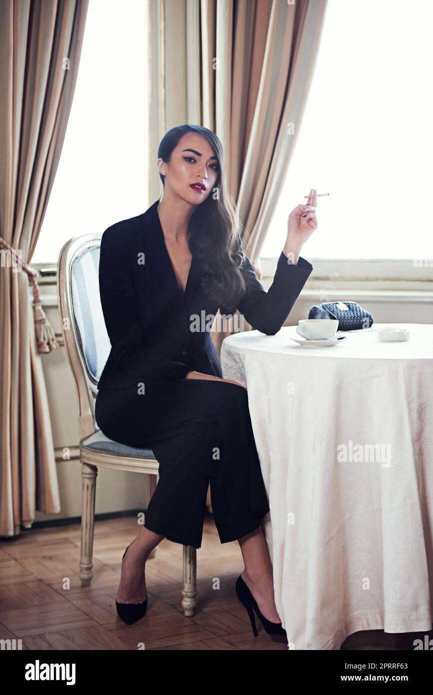 Shes Got Class A Woman Smoking A Cigarette In A Luxurious Setting