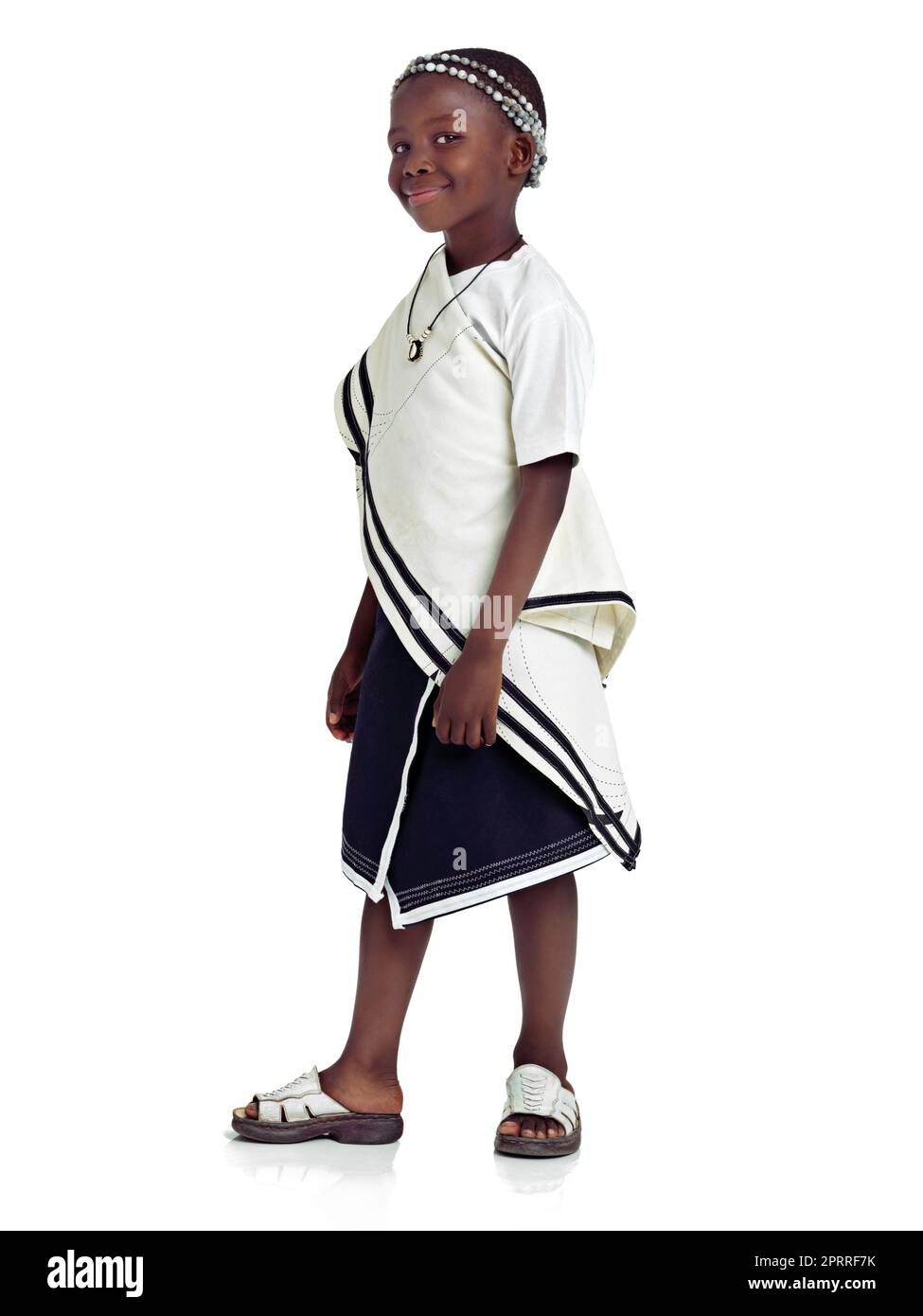 They grow up so fast. A young african boy against a white background ...