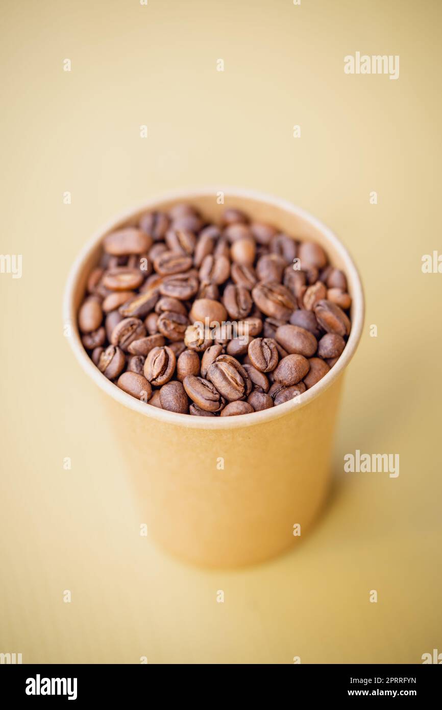 Freshly roasted coffee beans in a cup Stock Photo - Alamy