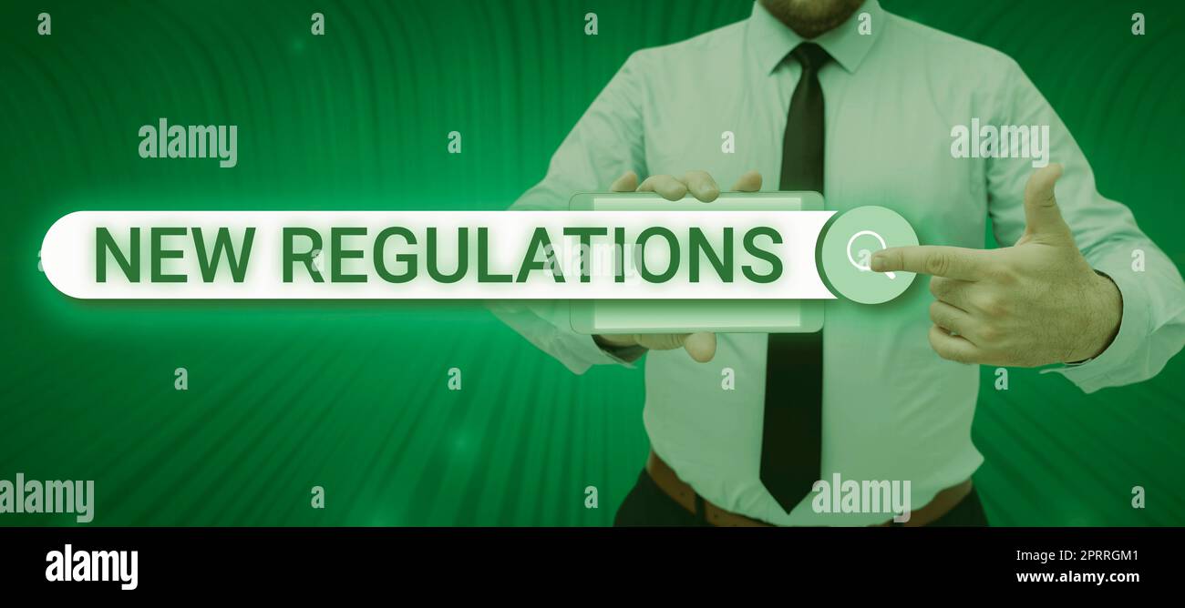 Hand writing sign New RegulationsRegulation controlling the activity ...