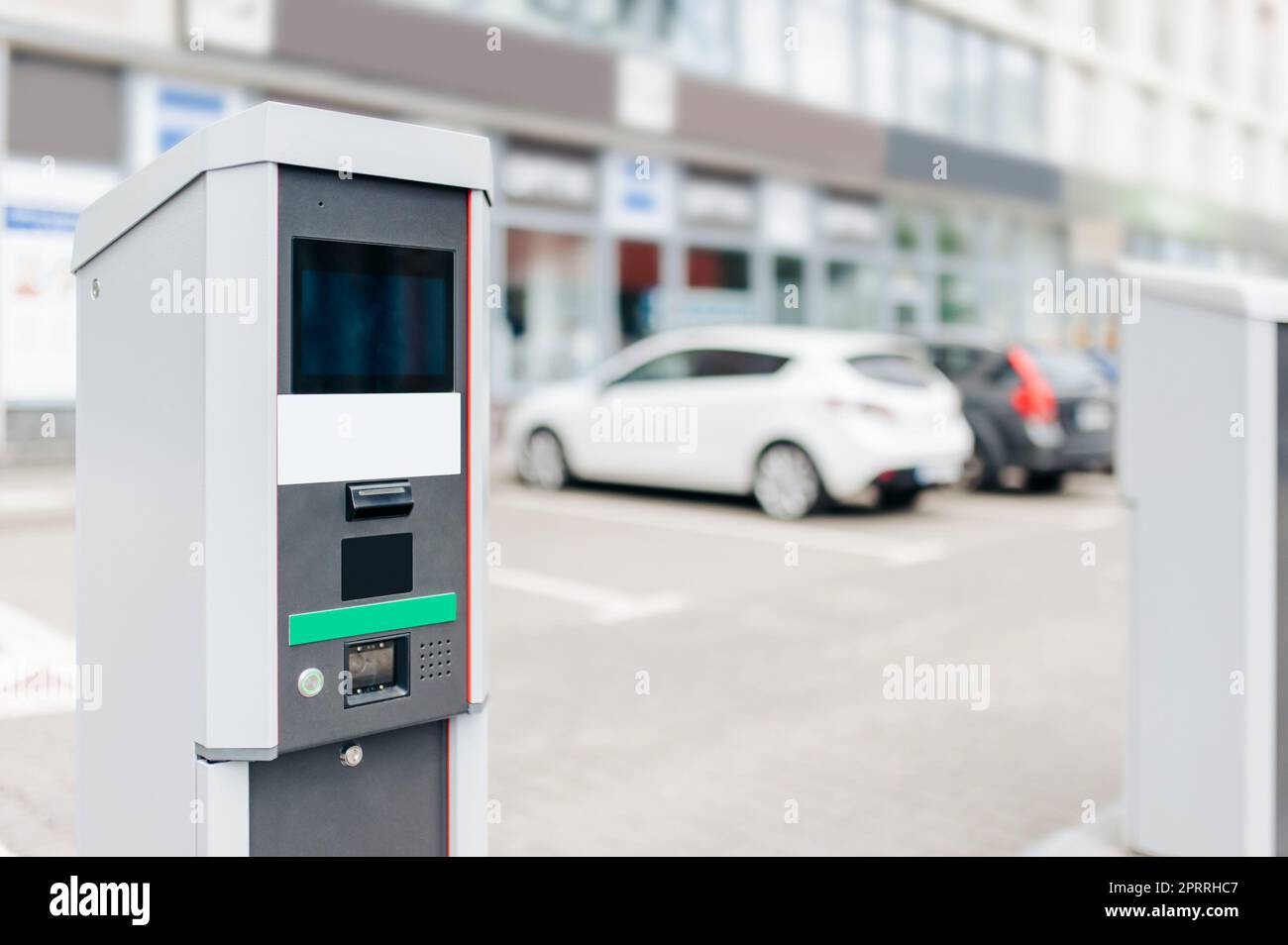 Modern parking meter on city street. Space for text Stock Photo - Alamy