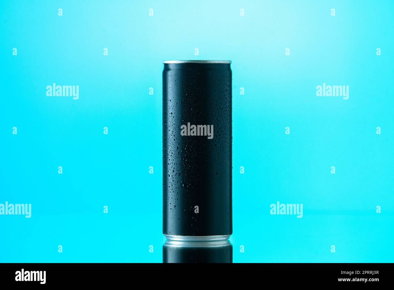 front view black metal drink can with water drops on light blue ...