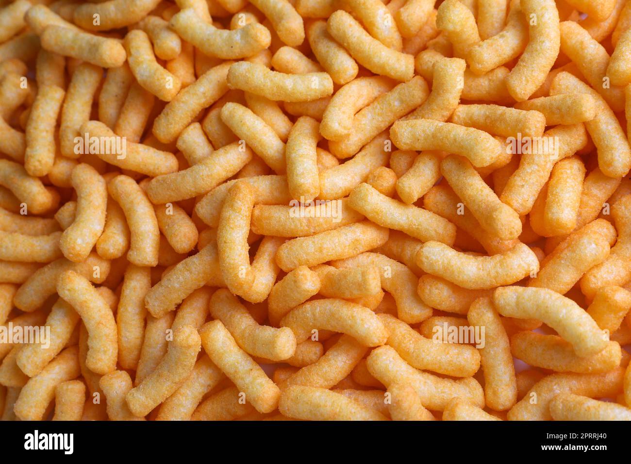 Crunchy cheese puffs hi-res stock photography and images - Alamy