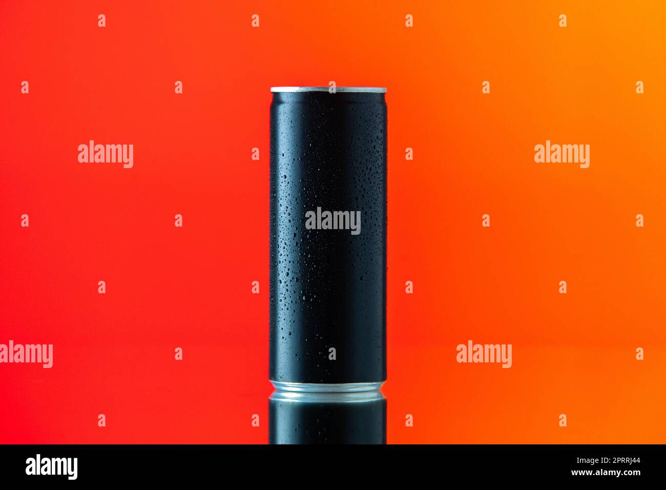 front view black metal drink can with water drops on fire red ...