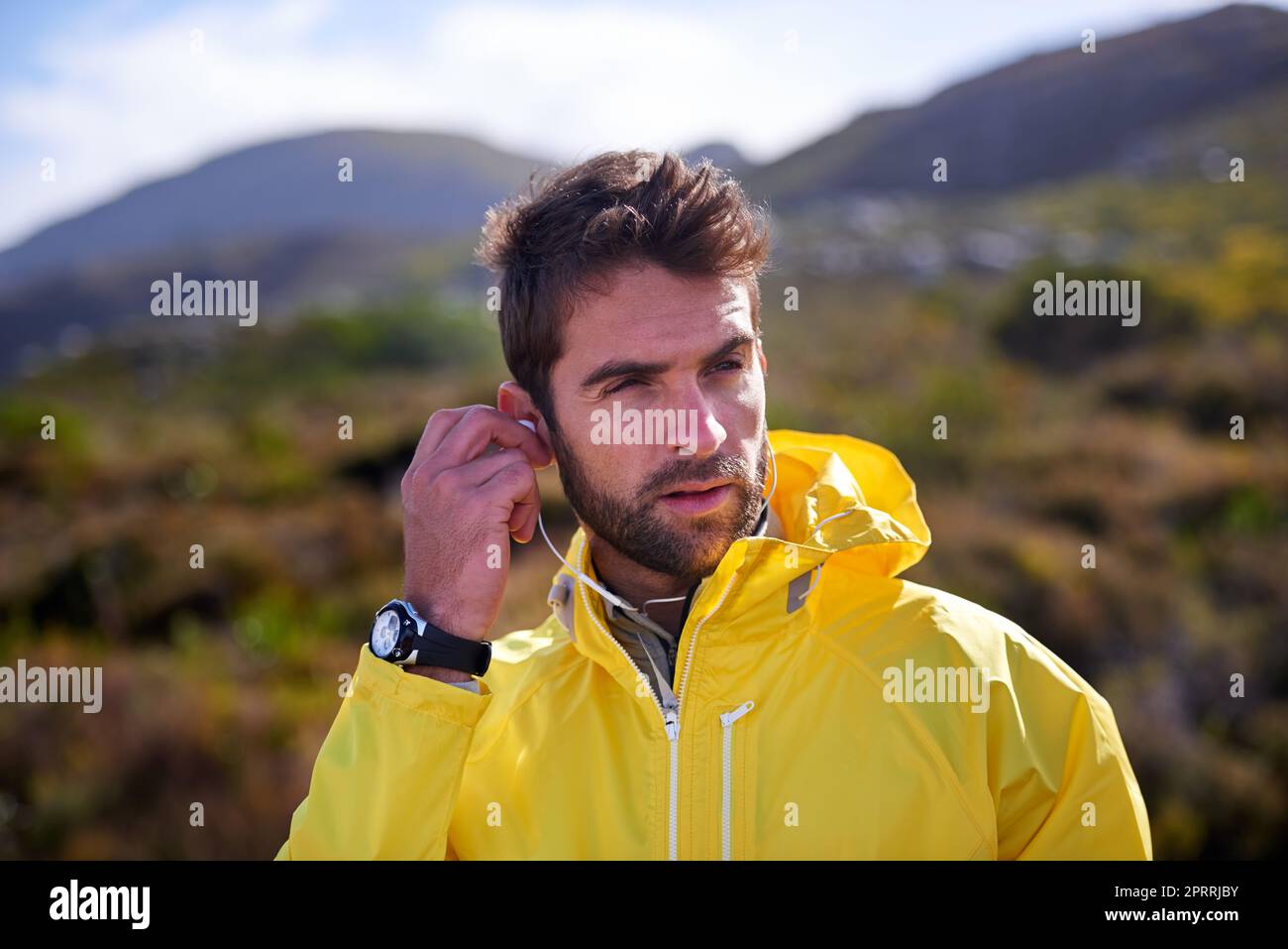 Making the most of beautiful running trails. a handsome young man ...