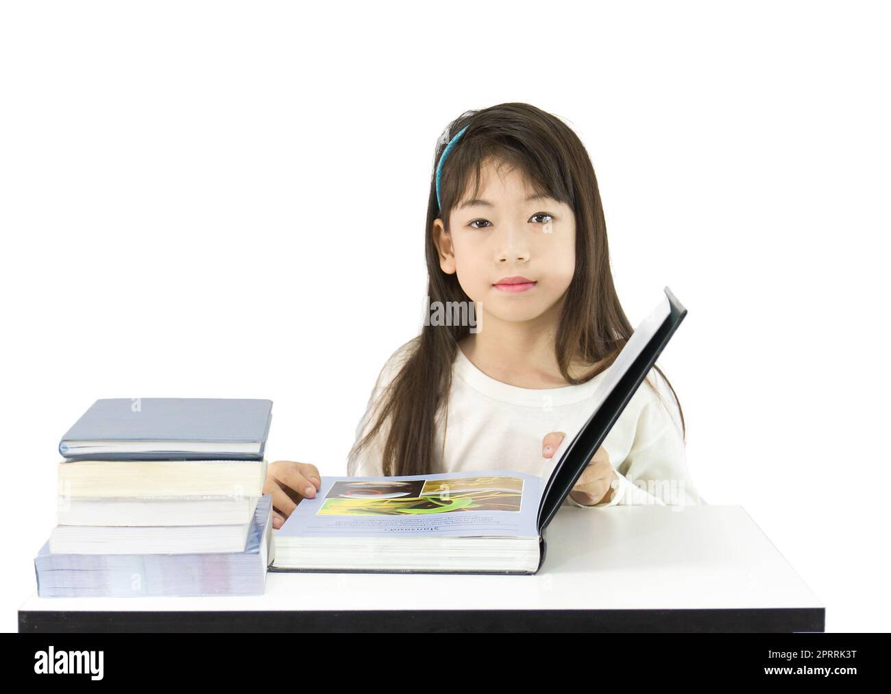 Young student reading the book Stock Photo - Alamy